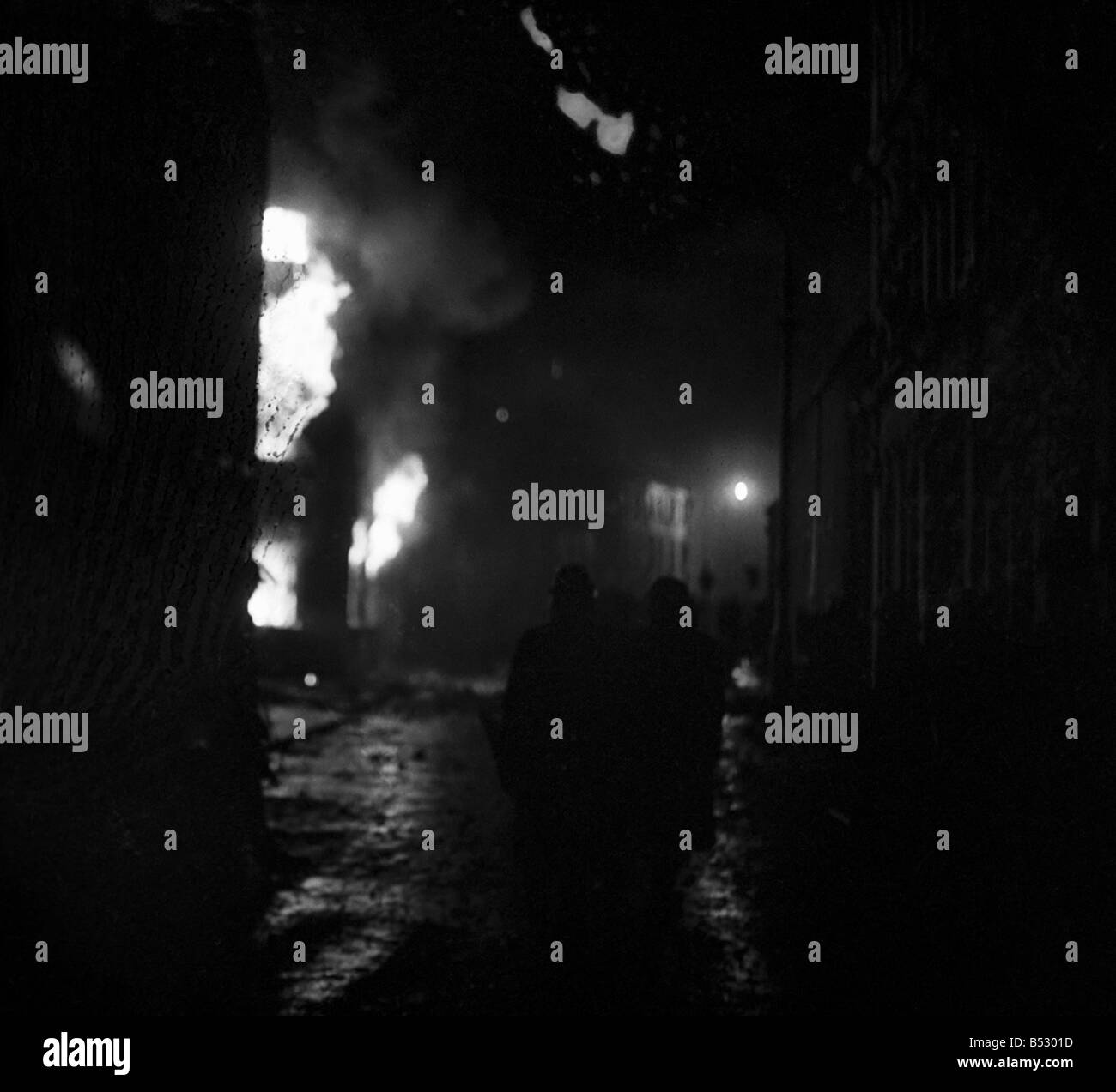 Policeman wearing gas masks and shields prepare a baton charge at ...