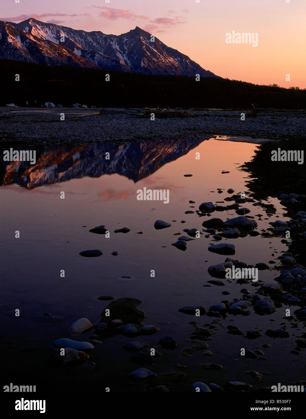 Alpenglow Light on Chugach Mountains reflecting in pool of Matanuska ...