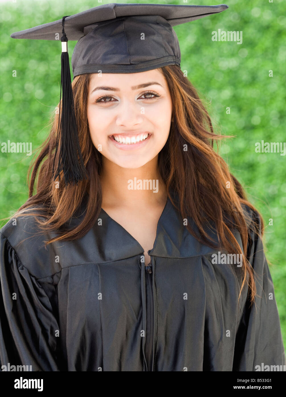 Middle Eastern woman in cap and gown Stock Photo - Alamy