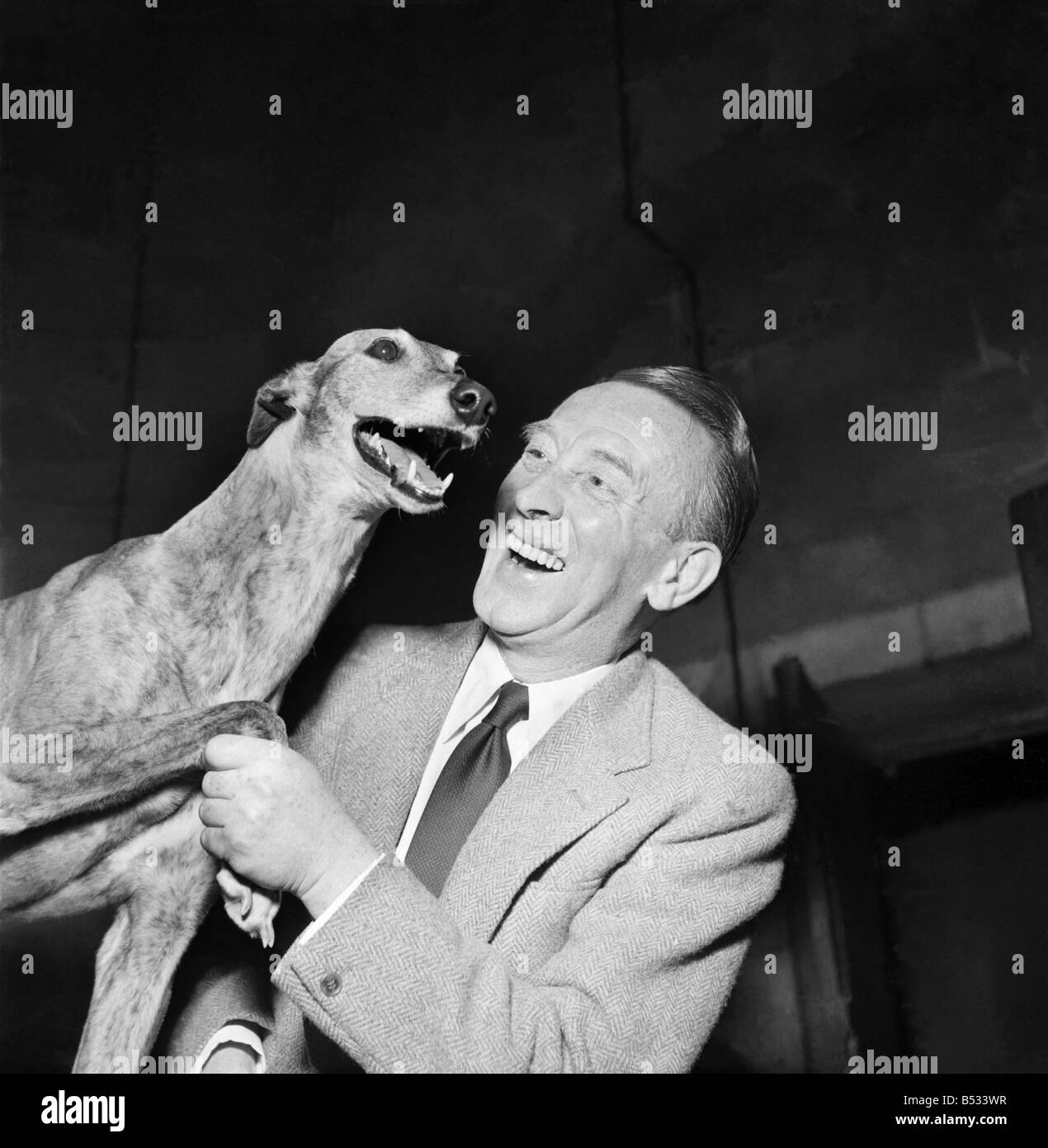 Comic actor Wilfred Pickles with "Lassie" the greyhound. March 1952 ...