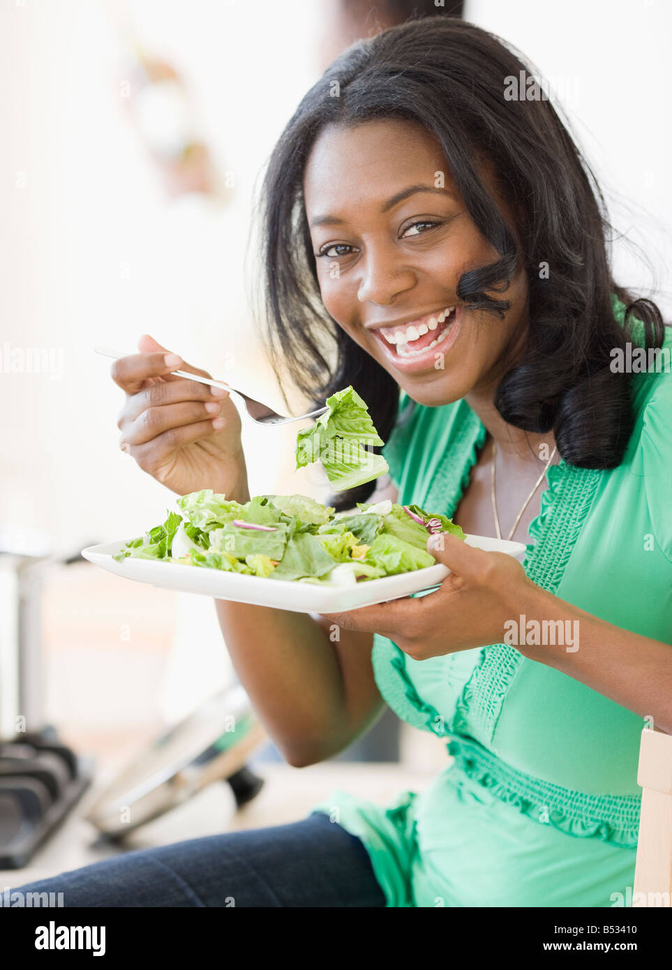 African woman eating salad Stock Photo - Alamy