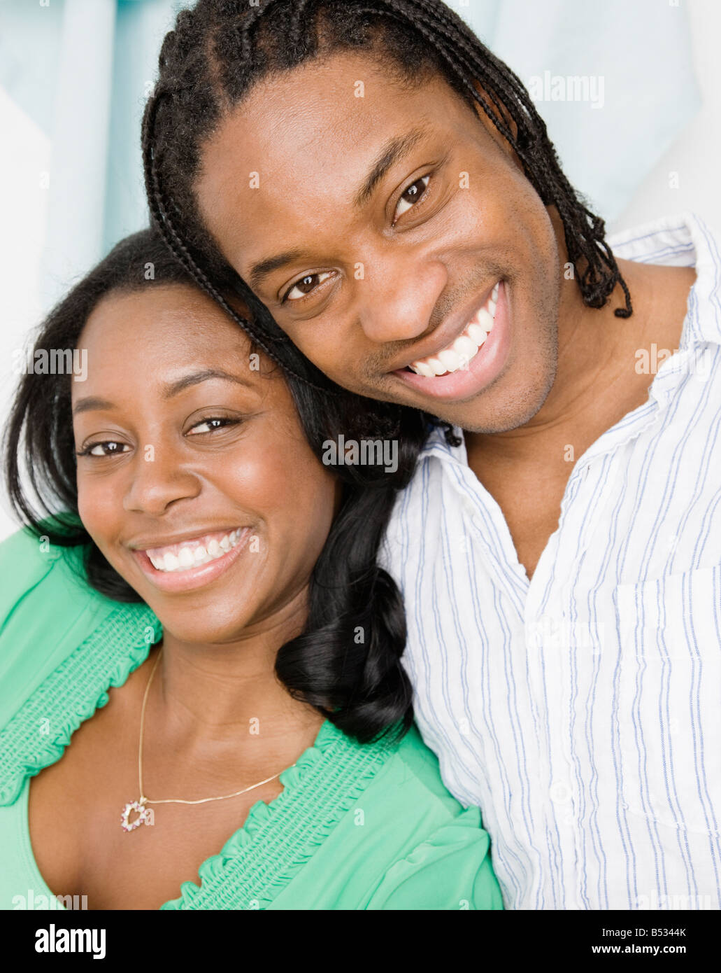 African couple hugging Stock Photo - Alamy