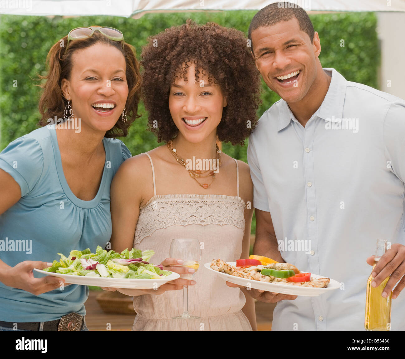 African man and women at cookout Stock Photo - Alamy