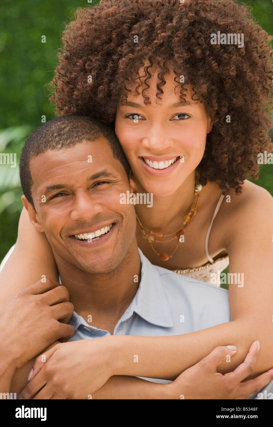 African couple hugging Stock Photo - Alamy