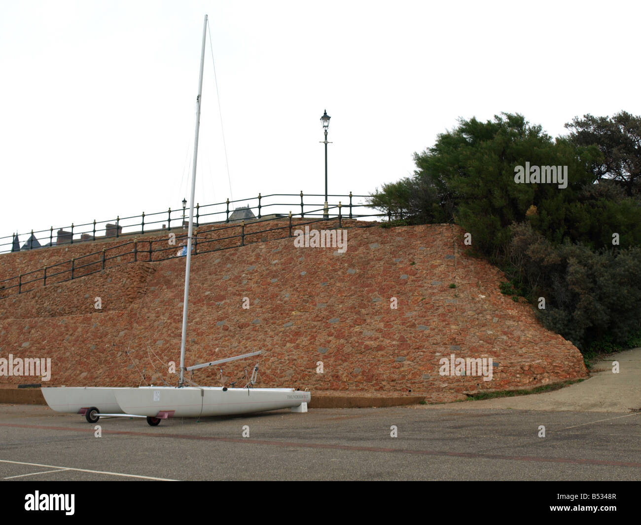 A single catamaran yacht in the car park on the promenade at Hunstanton ...