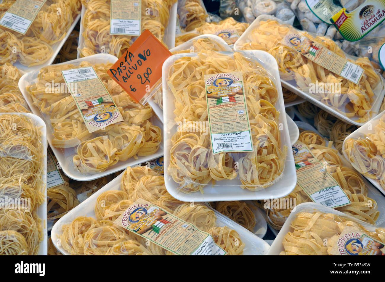 Packages of dried pasta for sale at the Campo de' Fiori market in Rome ...