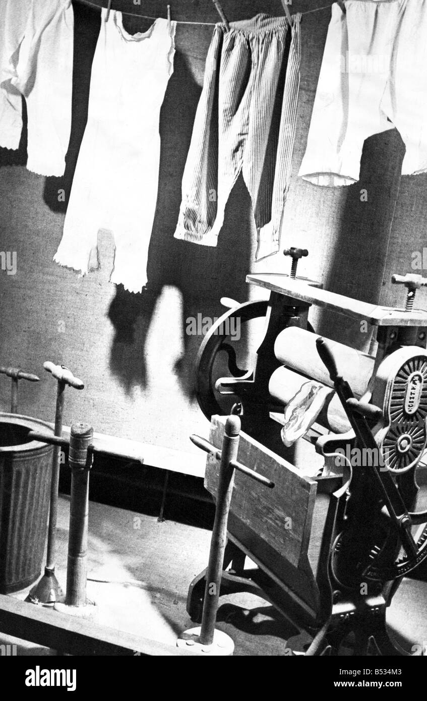 Mangle clothes Black and White Stock Photos & Images - Alamy