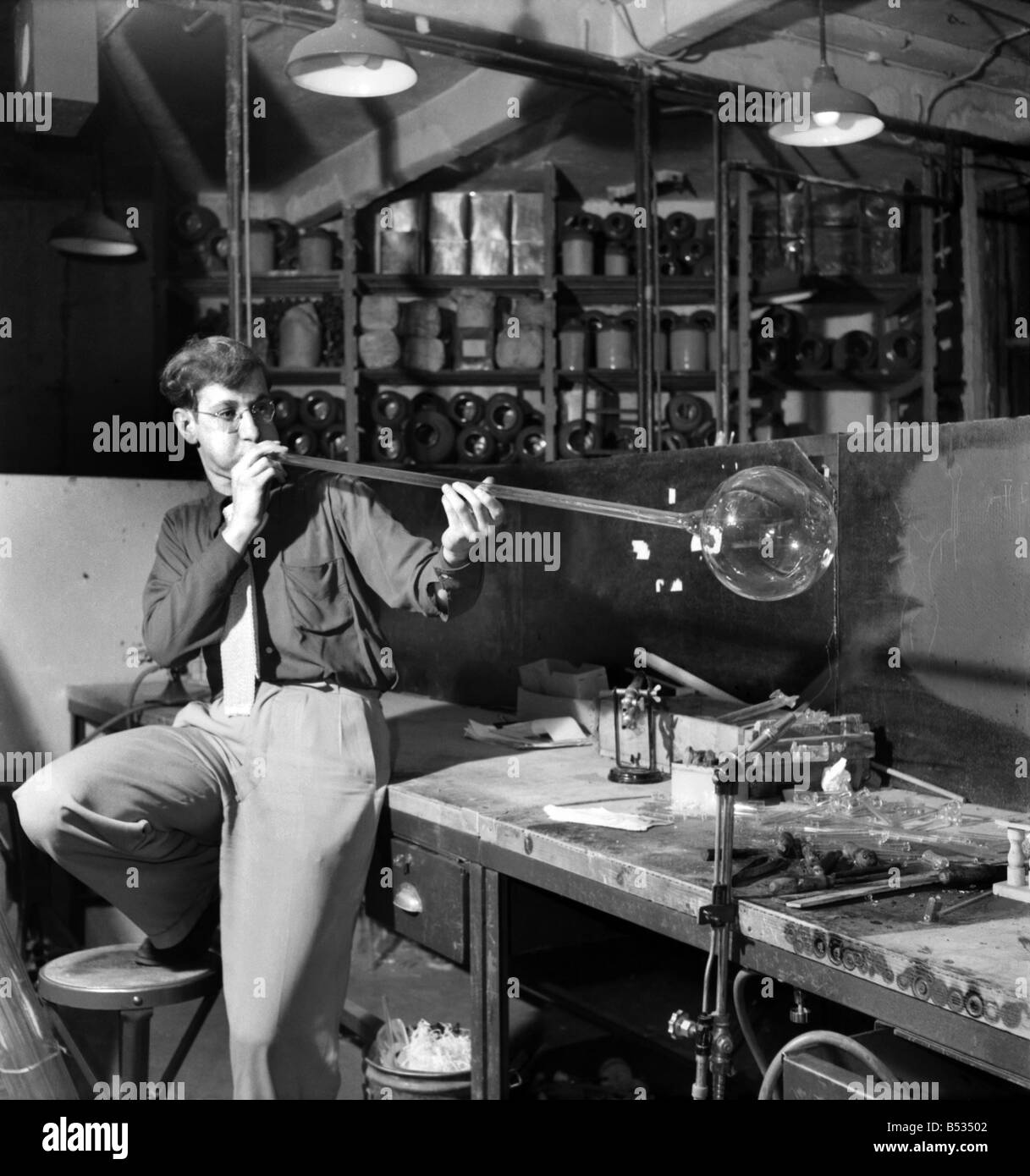 Glass blower Man blowing glass in his workshop. October 1952 C4910 ...