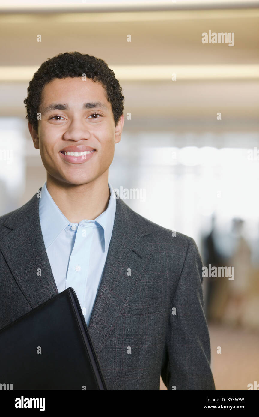 Mixed race businessman smiling Stock Photo - Alamy