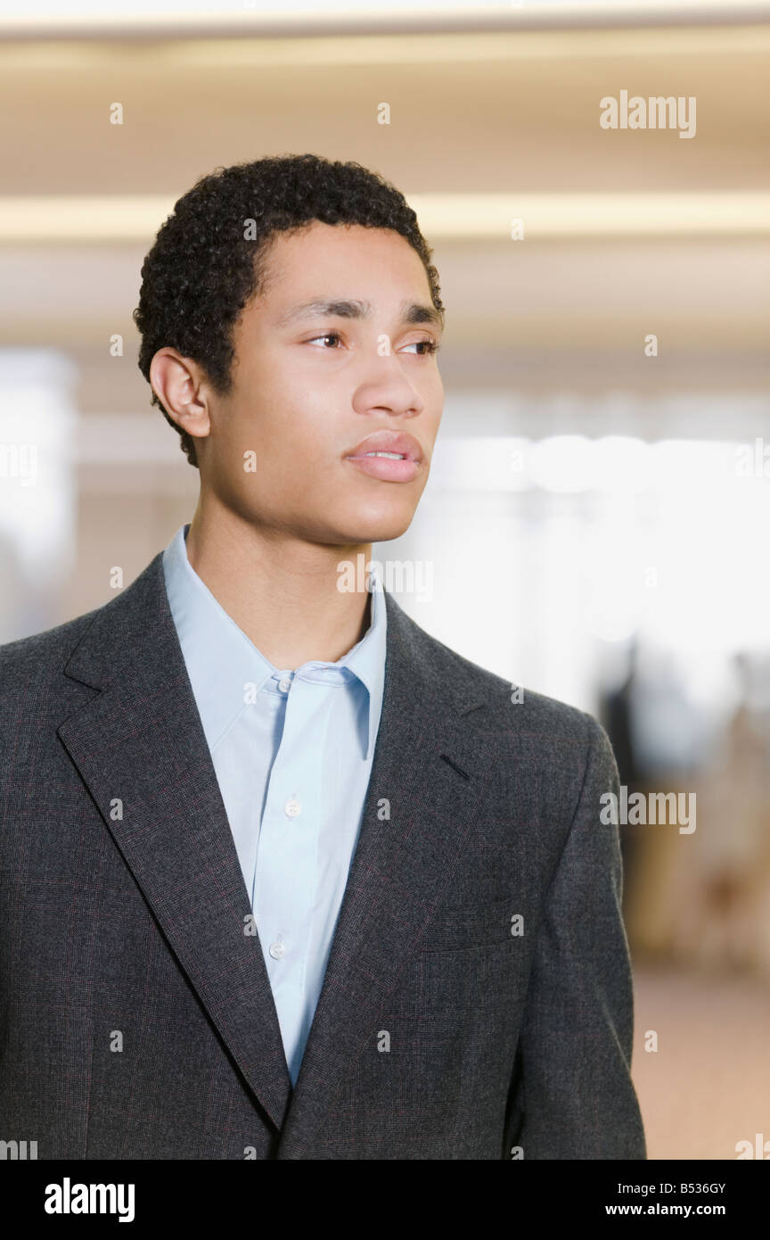 Mixed race businessman looking pensive Stock Photo - Alamy