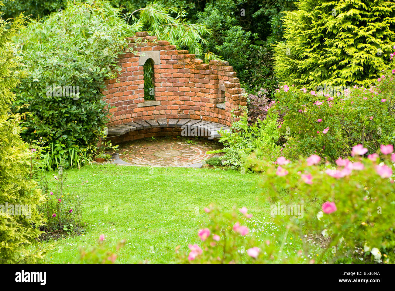 brick folly built as an informal seating area Stock Photo - Alamy