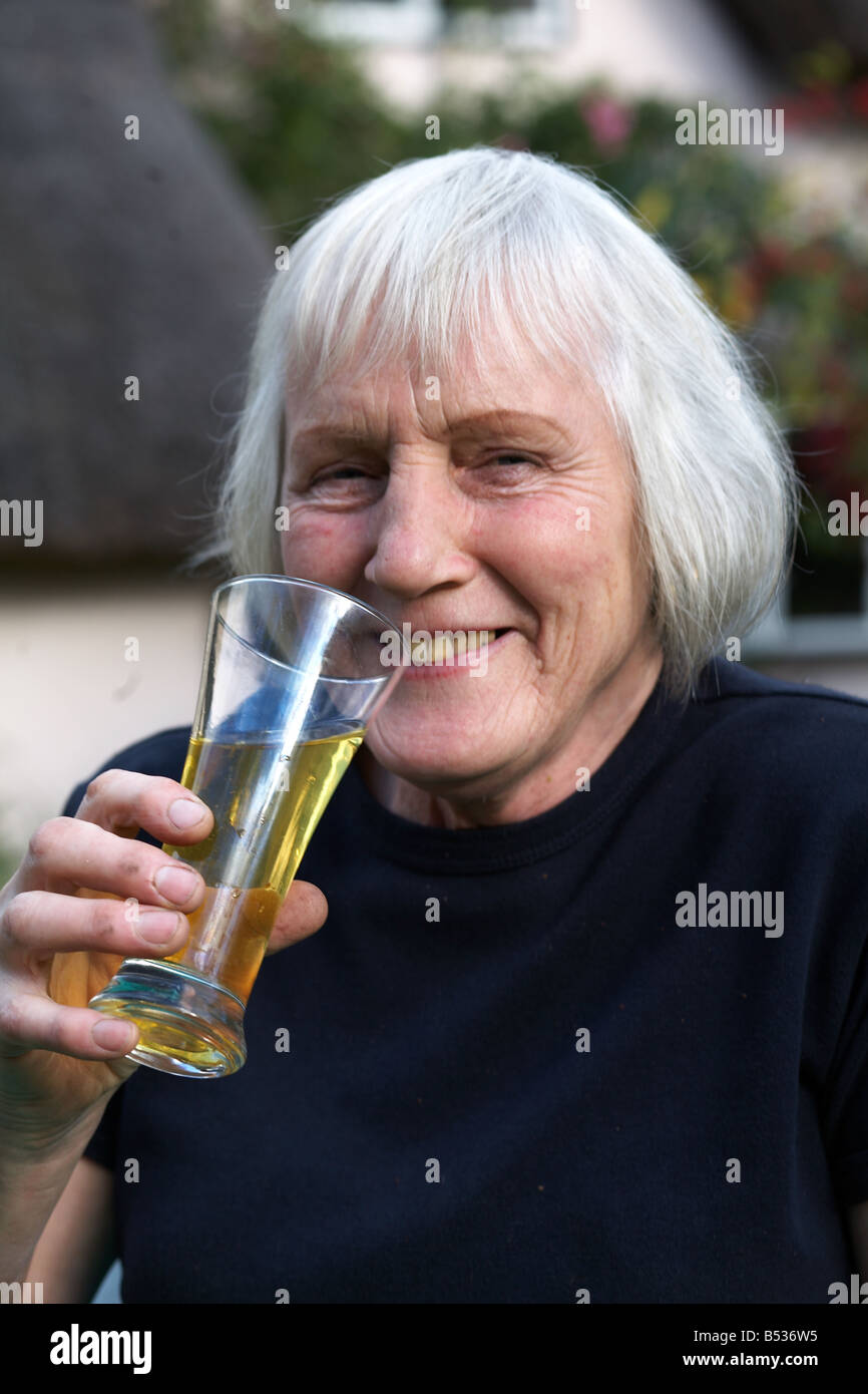 Woman tasting cider Stock Photo - Alamy