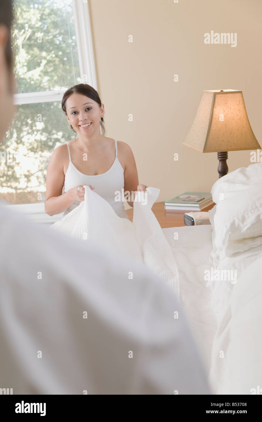 Two women making up bed hi-res stock photography and images - Alamy