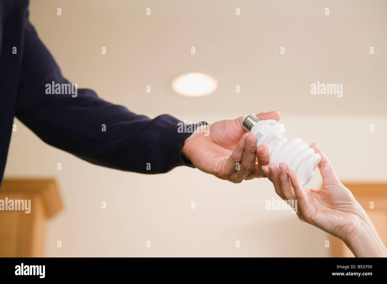 Woman holding replacement light hi-res stock photography and images - Alamy