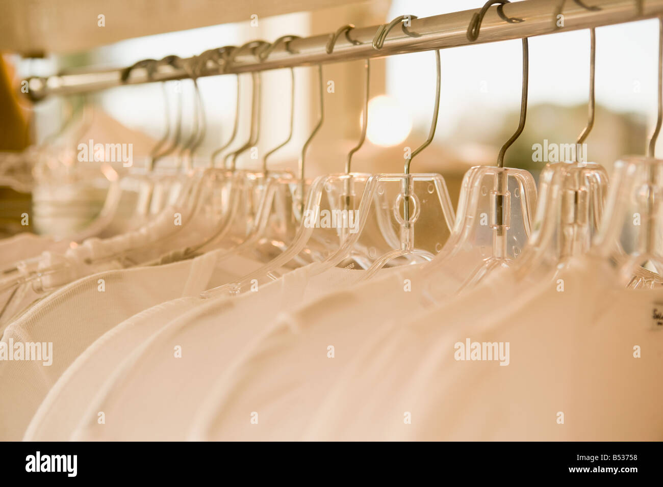 Close up of rack of clothes Stock Photo - Alamy