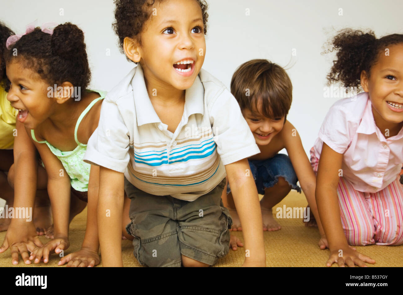 Kneeling with children hi-res stock photography and images - Alamy