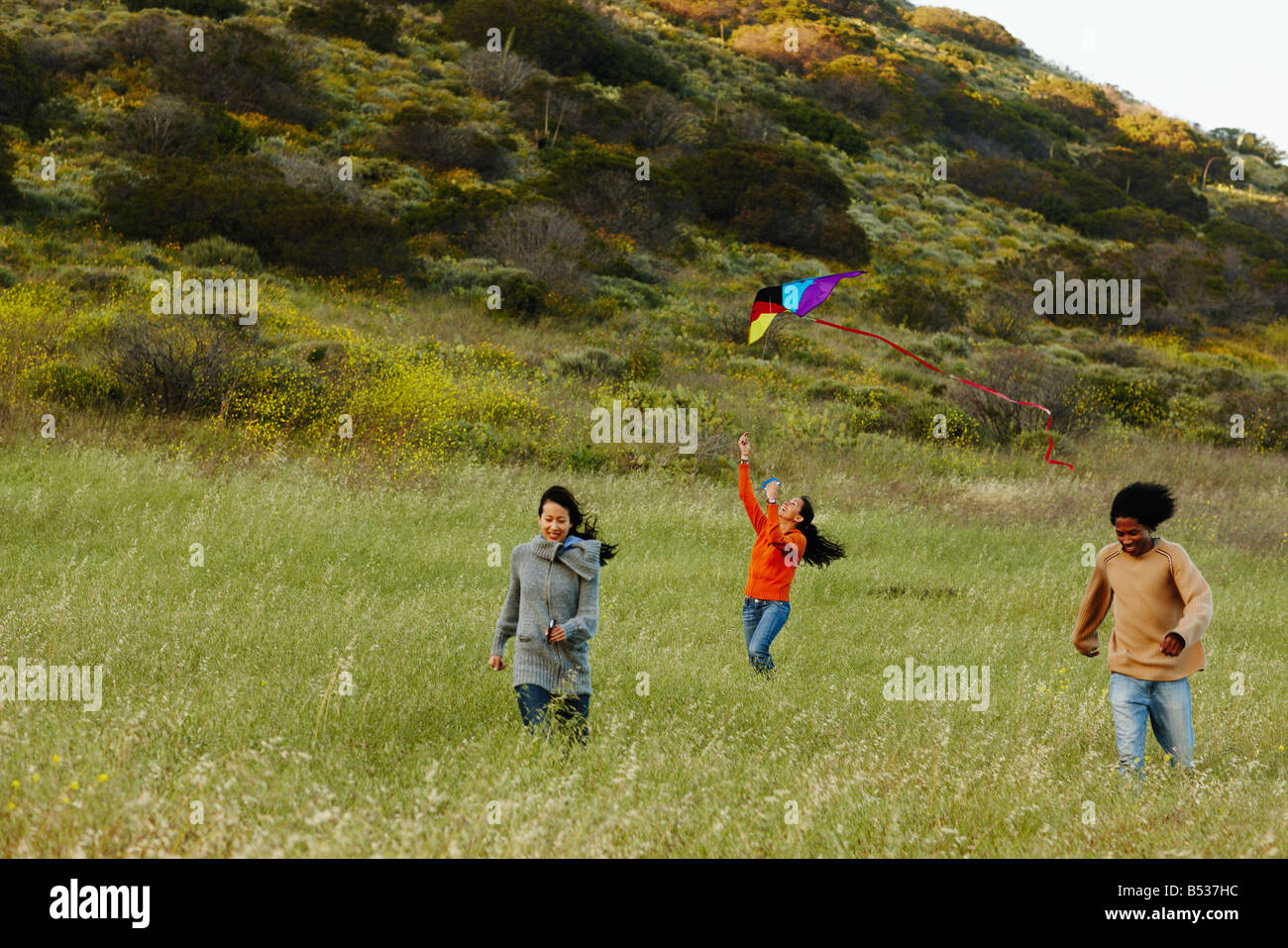 Friends flying kite hi-res stock photography and images - Alamy