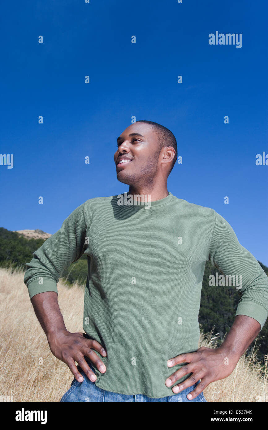 Mixed race man standing in rural area Stock Photo - Alamy