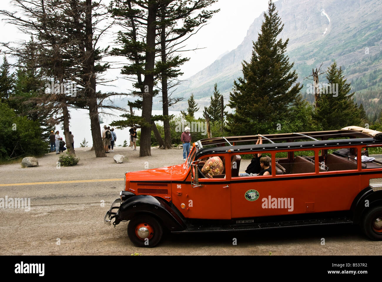 Propane powered red tour bus at Saint Mary Lake in Glacier National ...