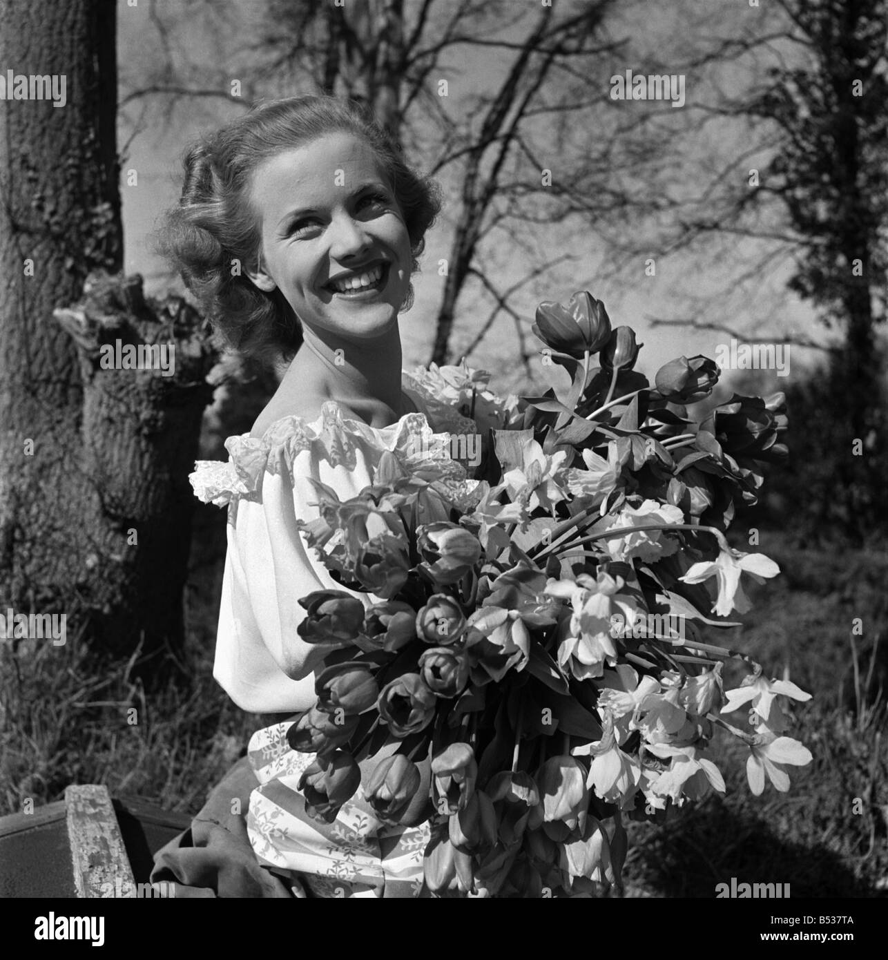 Actress Honor Blackman seen here with flowers in the gardens of ...
