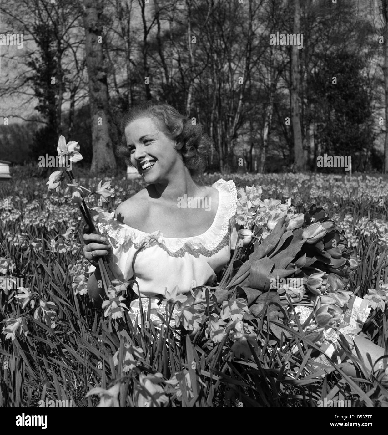 Actress Honor Blackman seen here with flowers in the gardens of ...