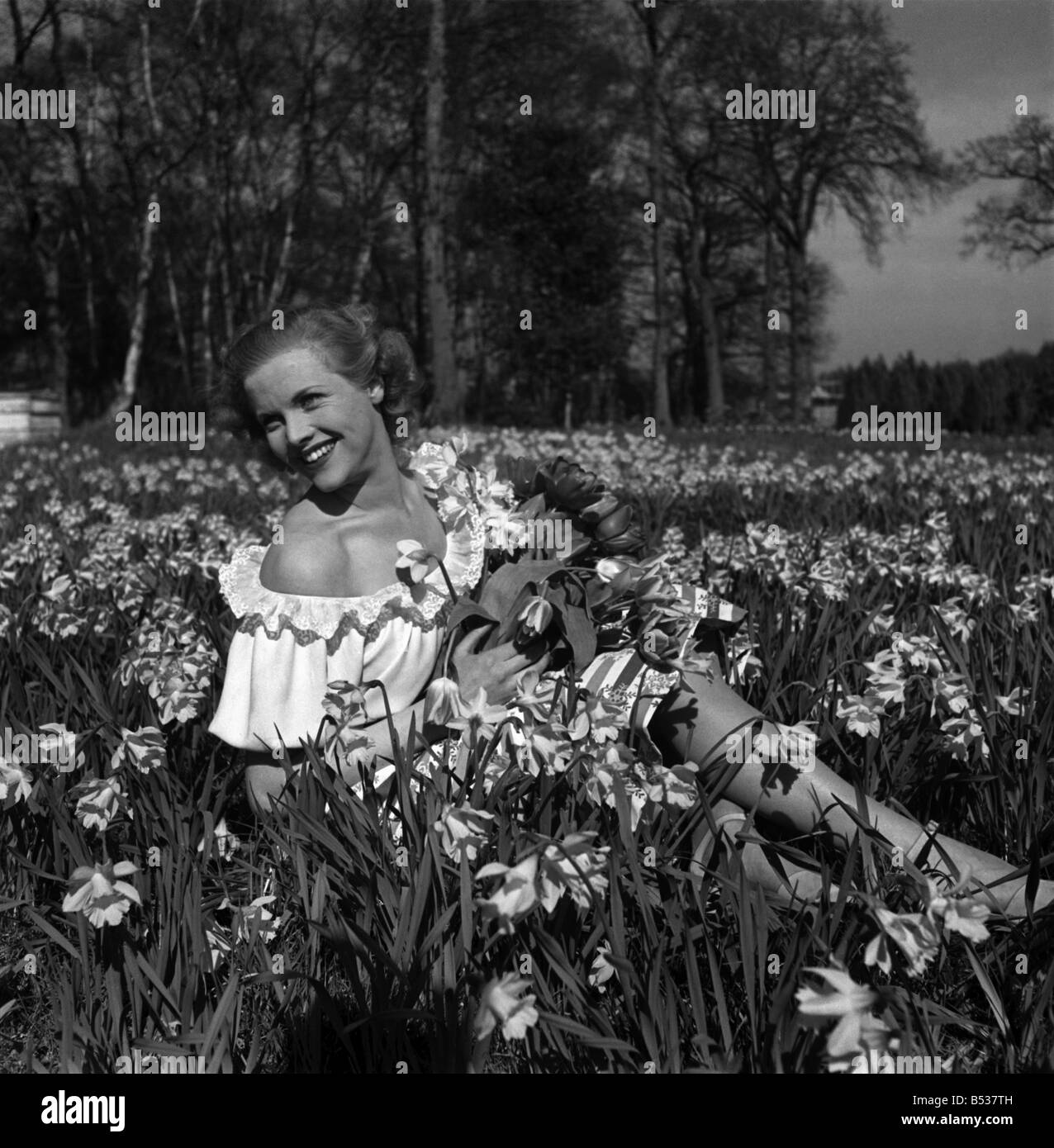 Actress Honor Blackman seen here with flowers in the gardens of ...