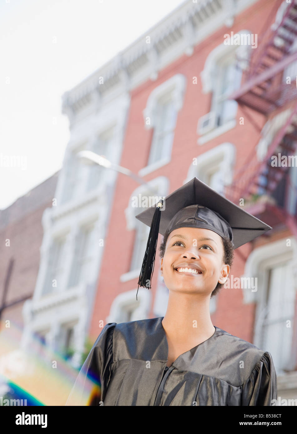 African woman in graduation cap and gown Stock Photo - Alamy