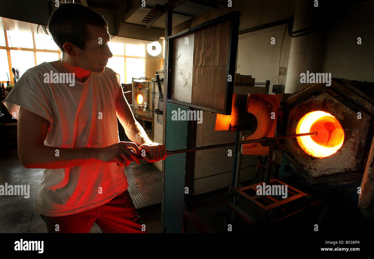 Glassblower Layne Rowe creates a glass bowl art work in the London ...