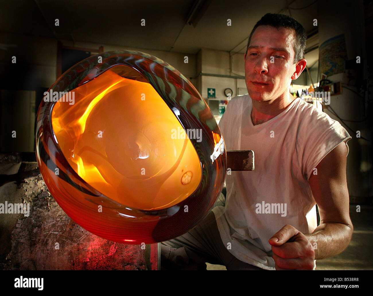 Glassblower Layne Rowe creates a glass bowl art work in the London ...