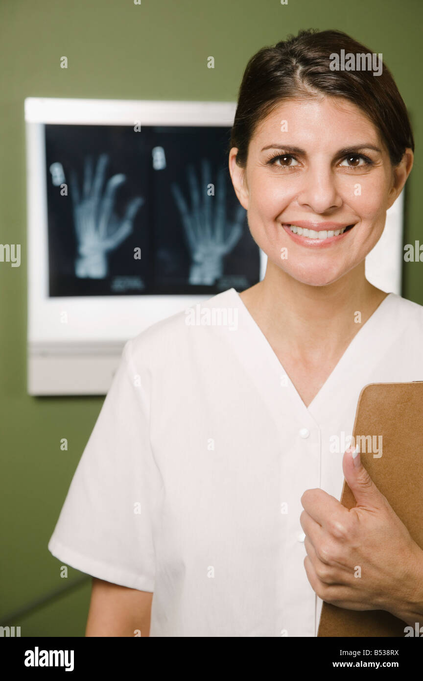 Doctor with medical chart and x-rays Stock Photo - Alamy
