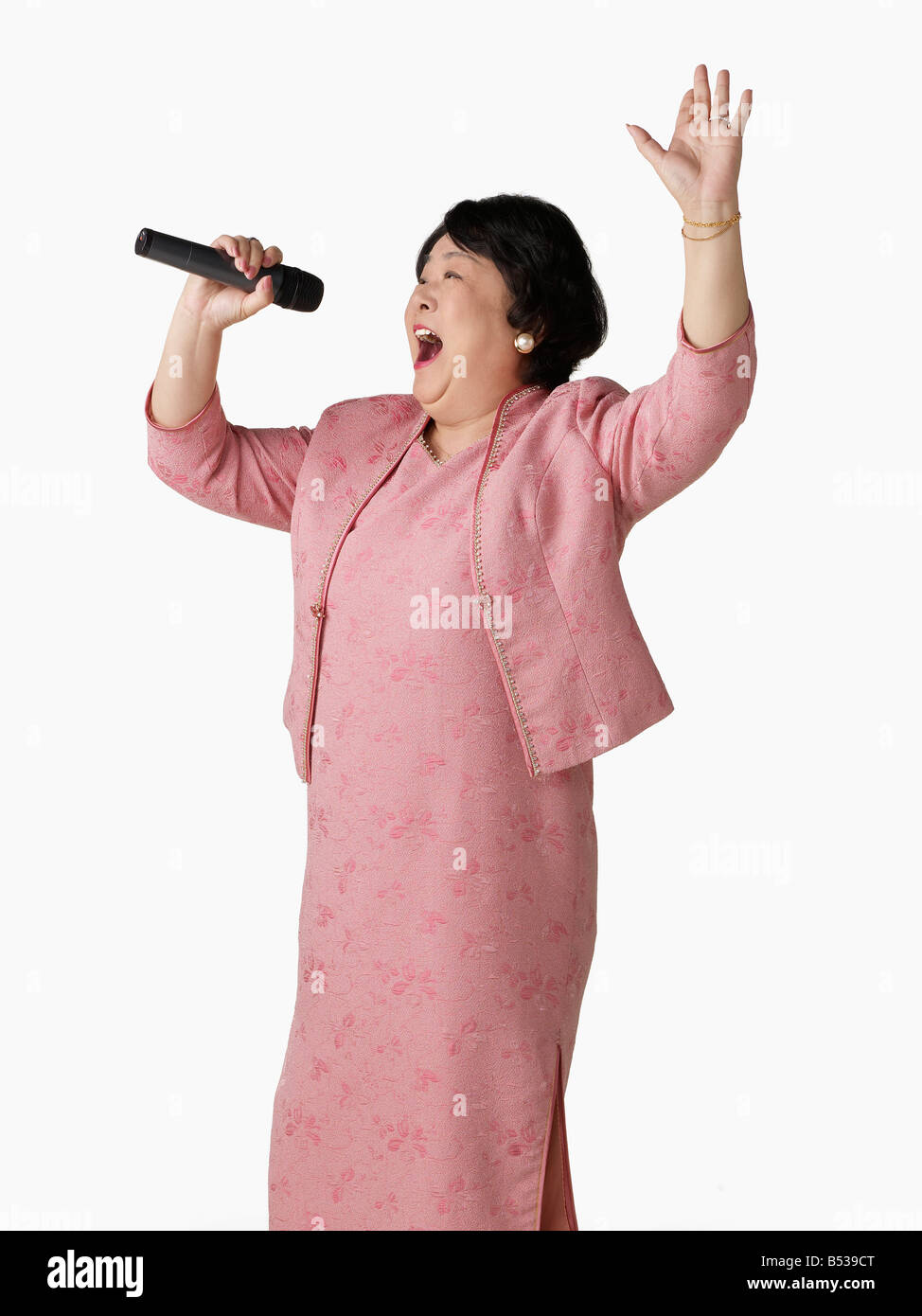 Confident Asian woman singing Stock Photo - Alamy