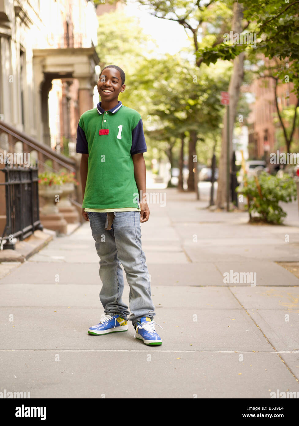 African teenage boy smiling in urban setting Stock Photo - Alamy