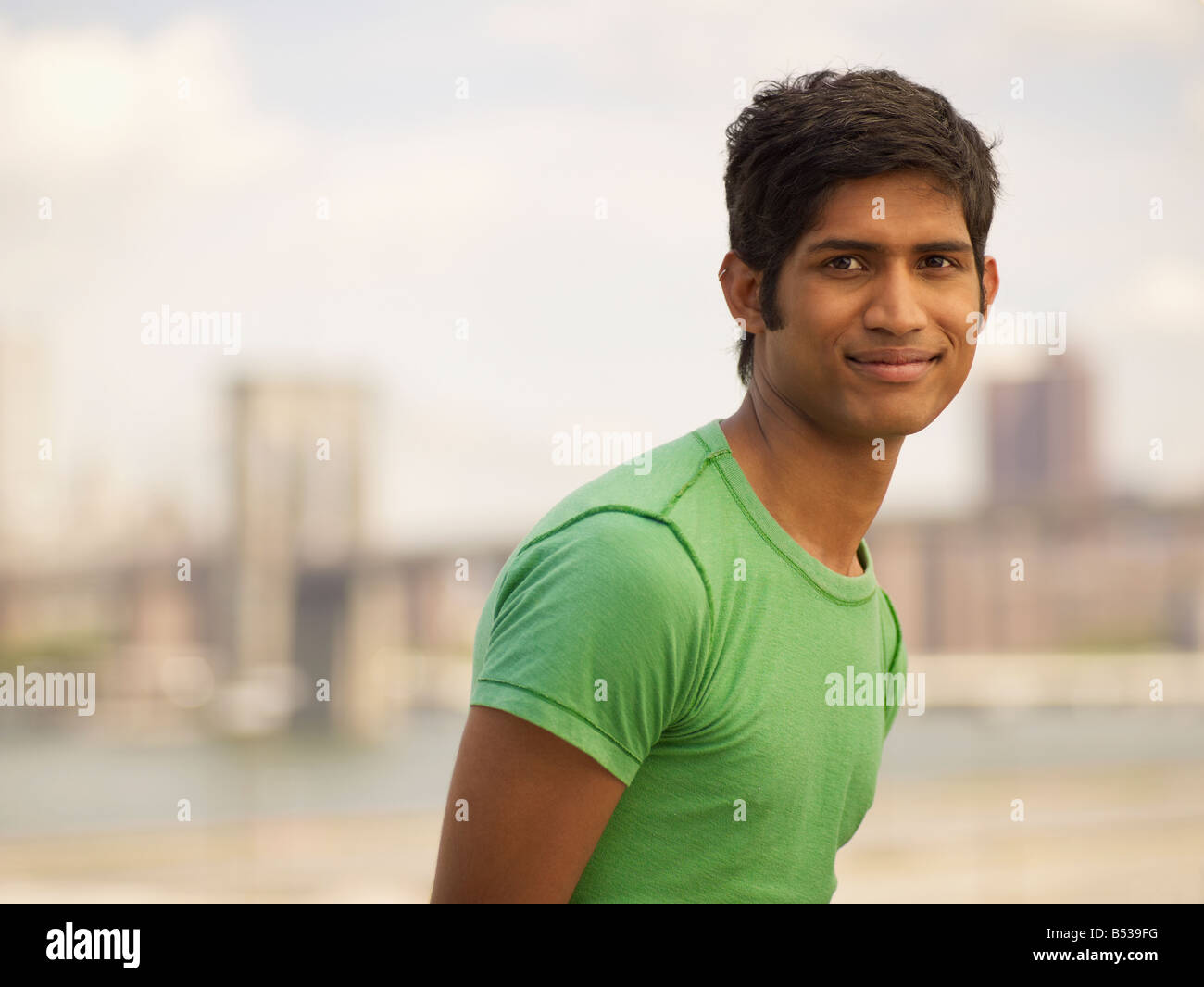 Confident Indian man smiling Stock Photo - Alamy