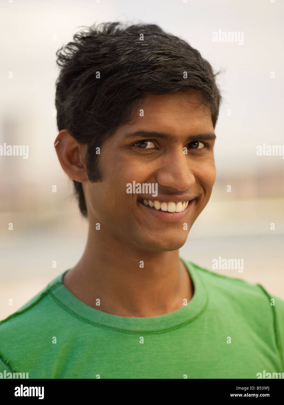 Confident Indian man smiling Stock Photo - Alamy