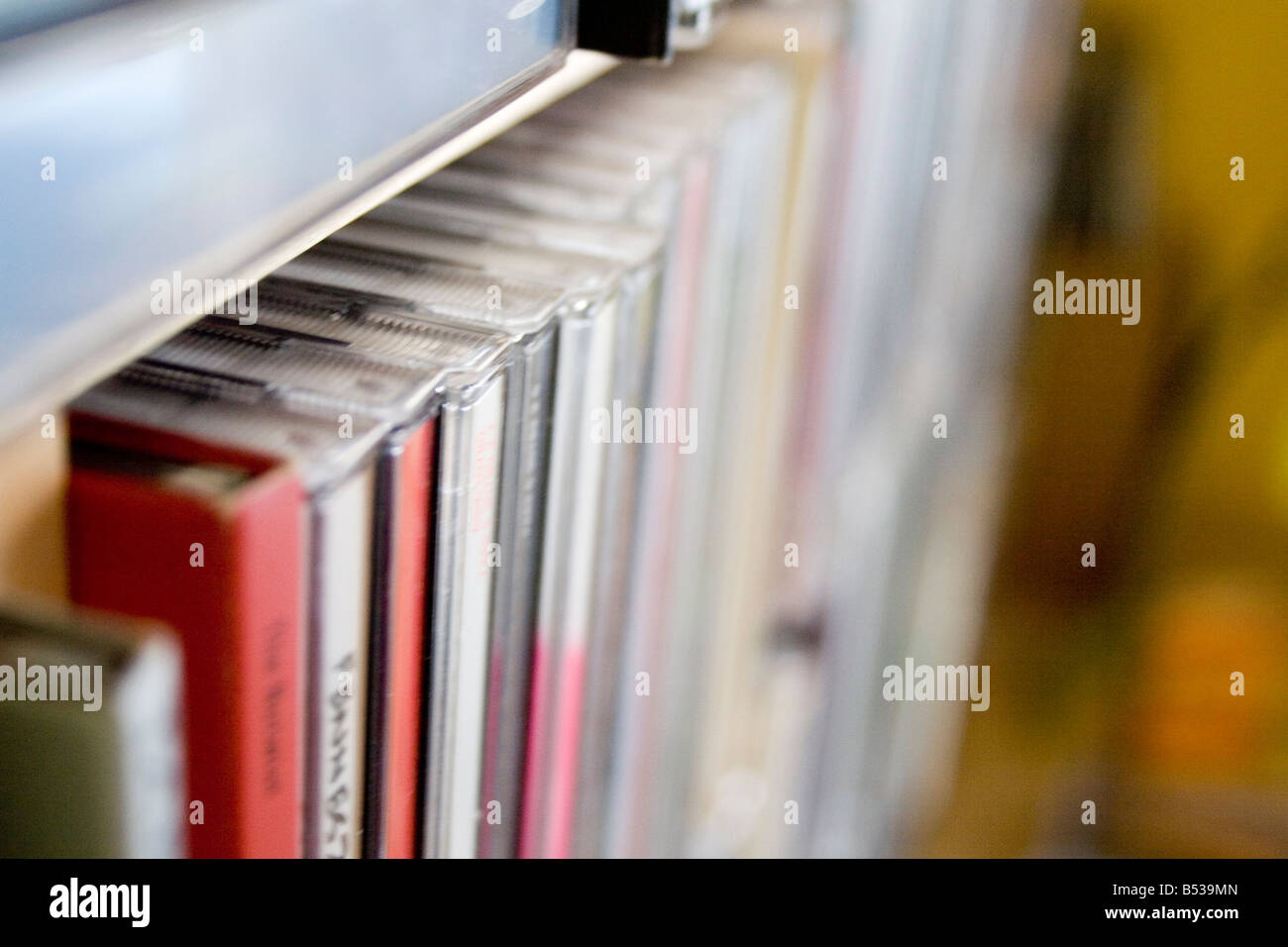 Music CD collection stacked on shelves Stock Photo - Alamy