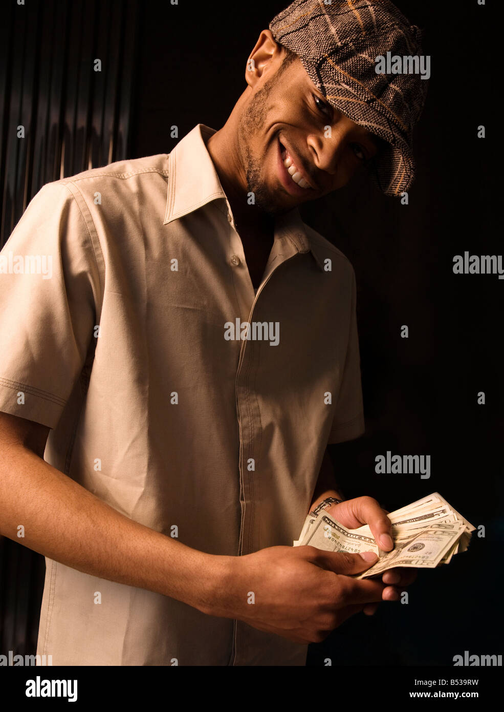 African man counting money Stock Photo - Alamy