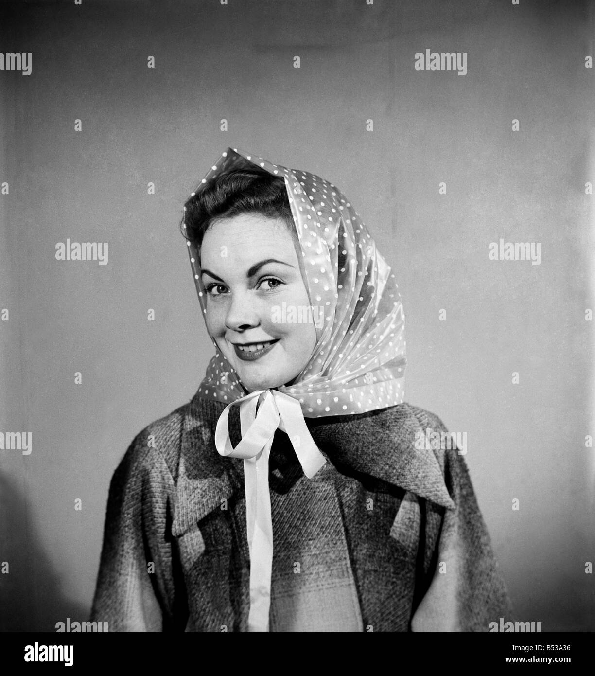 Woman poses wearing long coat hi-res stock photography and images - Alamy