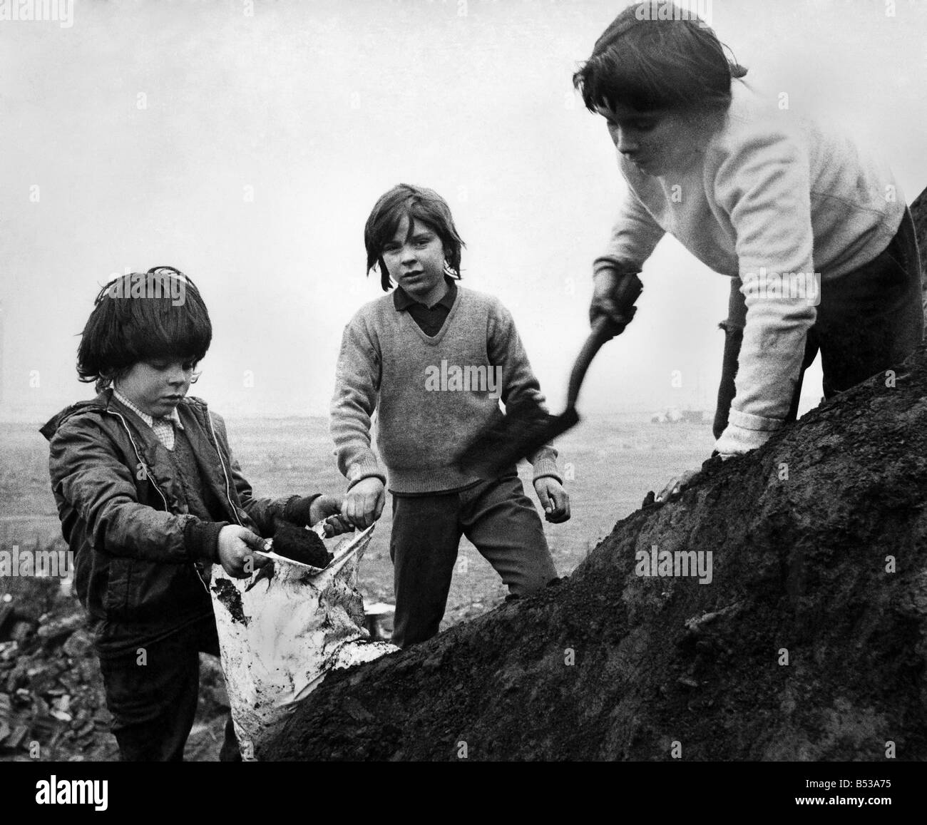 Boy miners digging for coal in the old mine at Cobridge North ...