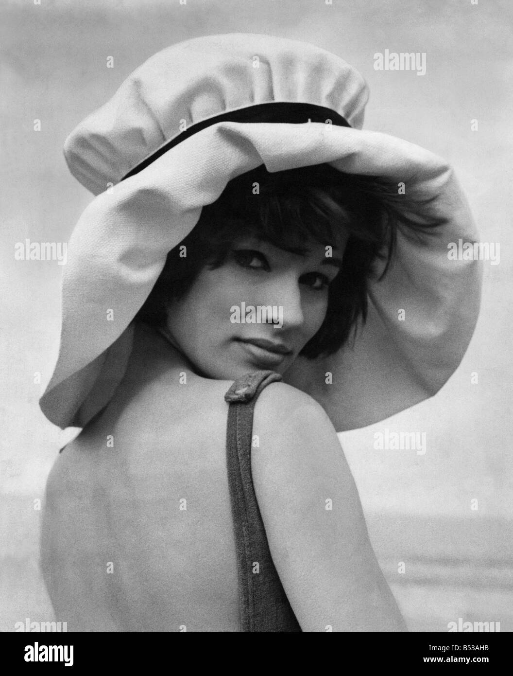 Clothing Beach. Look a poppet in the hat that says peek-a-boo as it ...