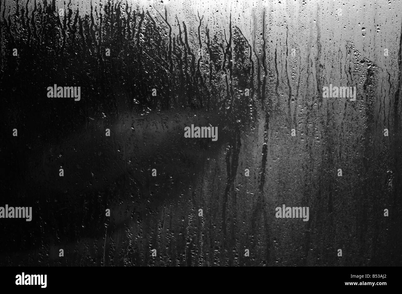 Melting frost running down a window pane Stock Photo - Alamy