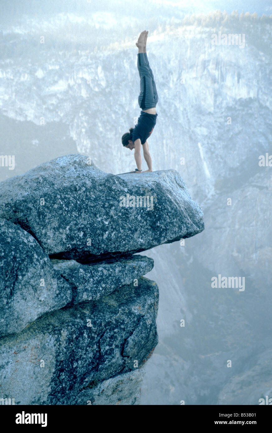 Performing a handstand on "Overhanging Rock" at Glacier Point, Yosemite ...