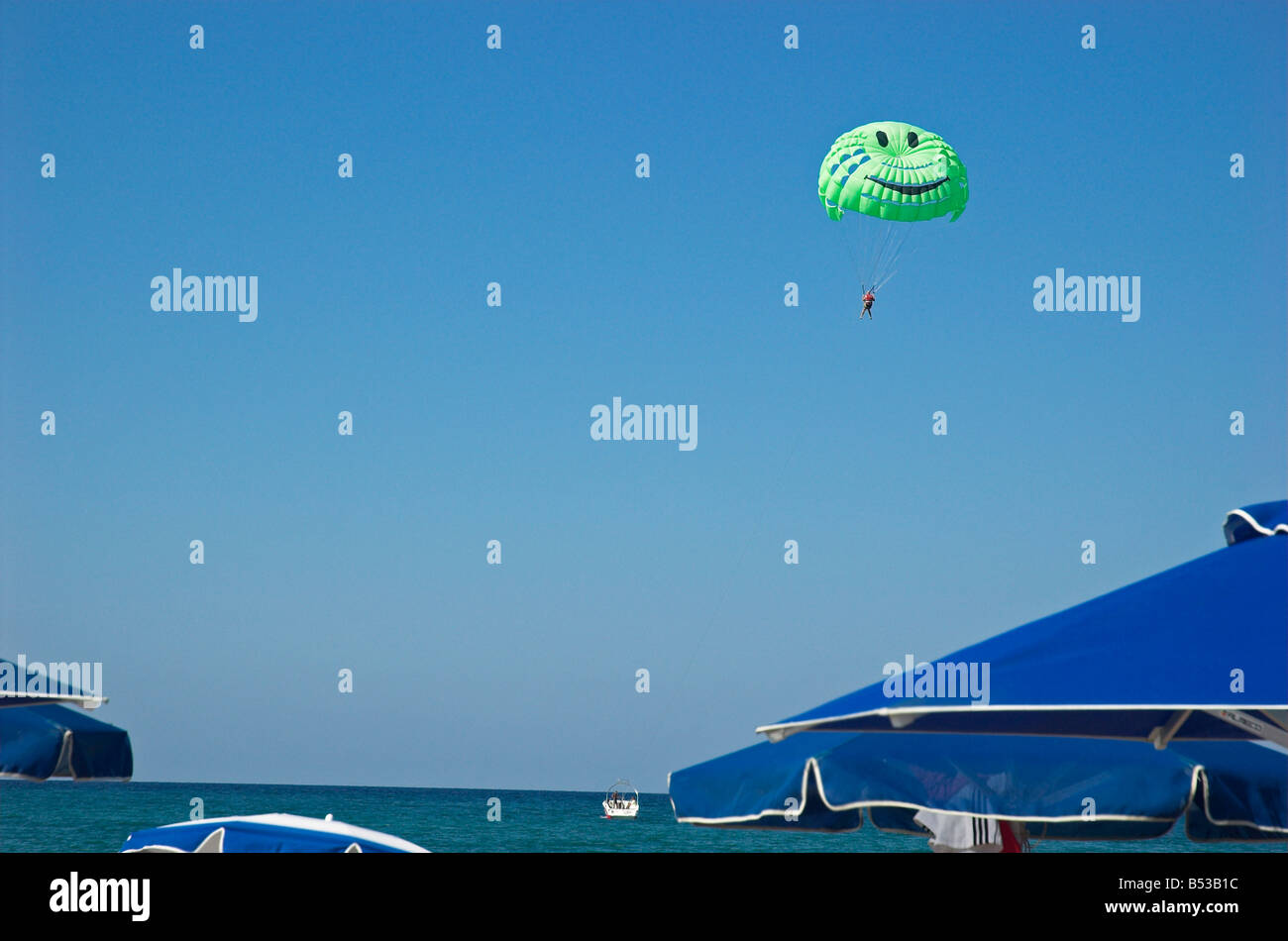 Unrecognizable person parasailing over sea Crete Rethymno Greece ...