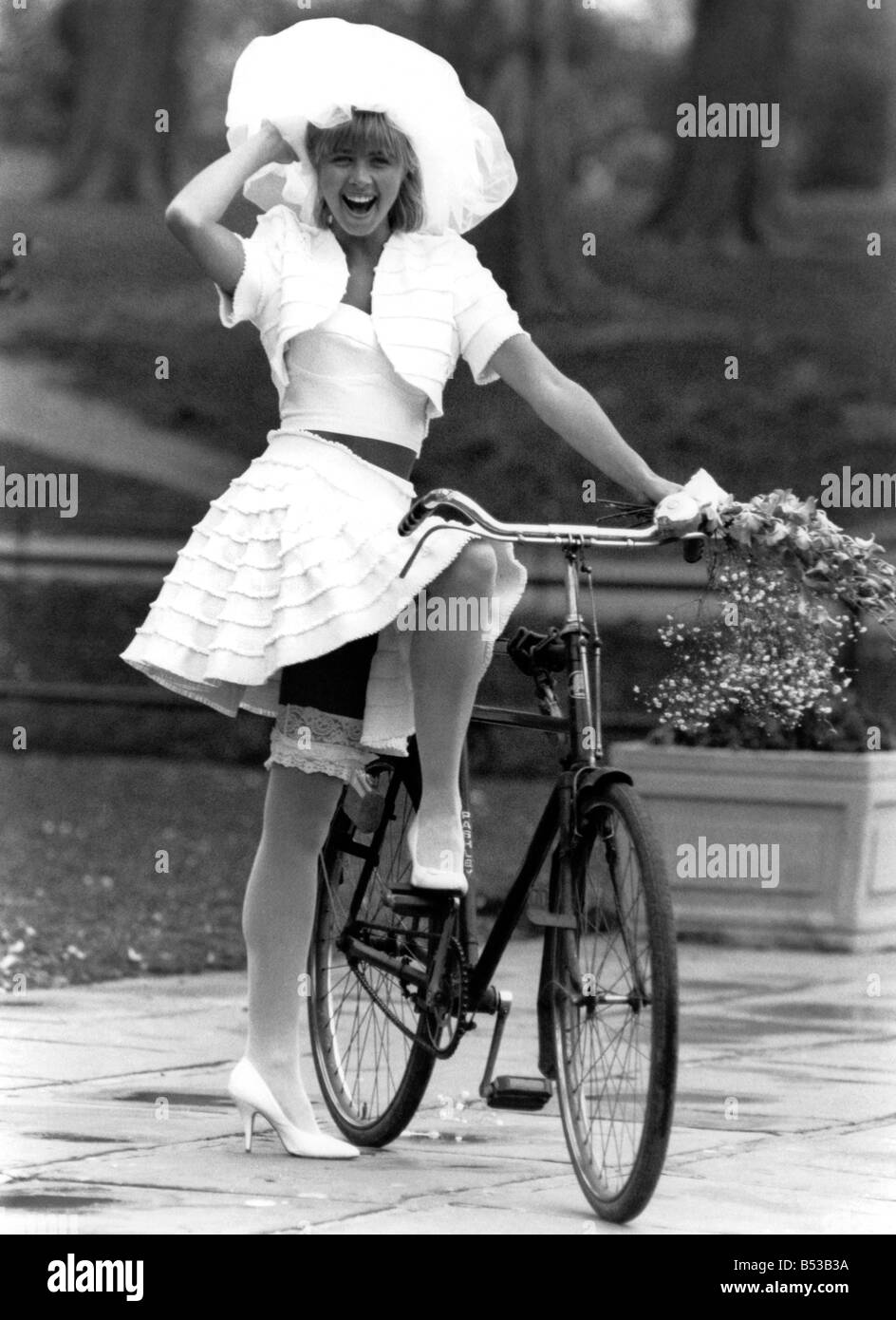 Rubbery Model Jane Sturdy. Wears white outfit, stockings and frilly hat ...