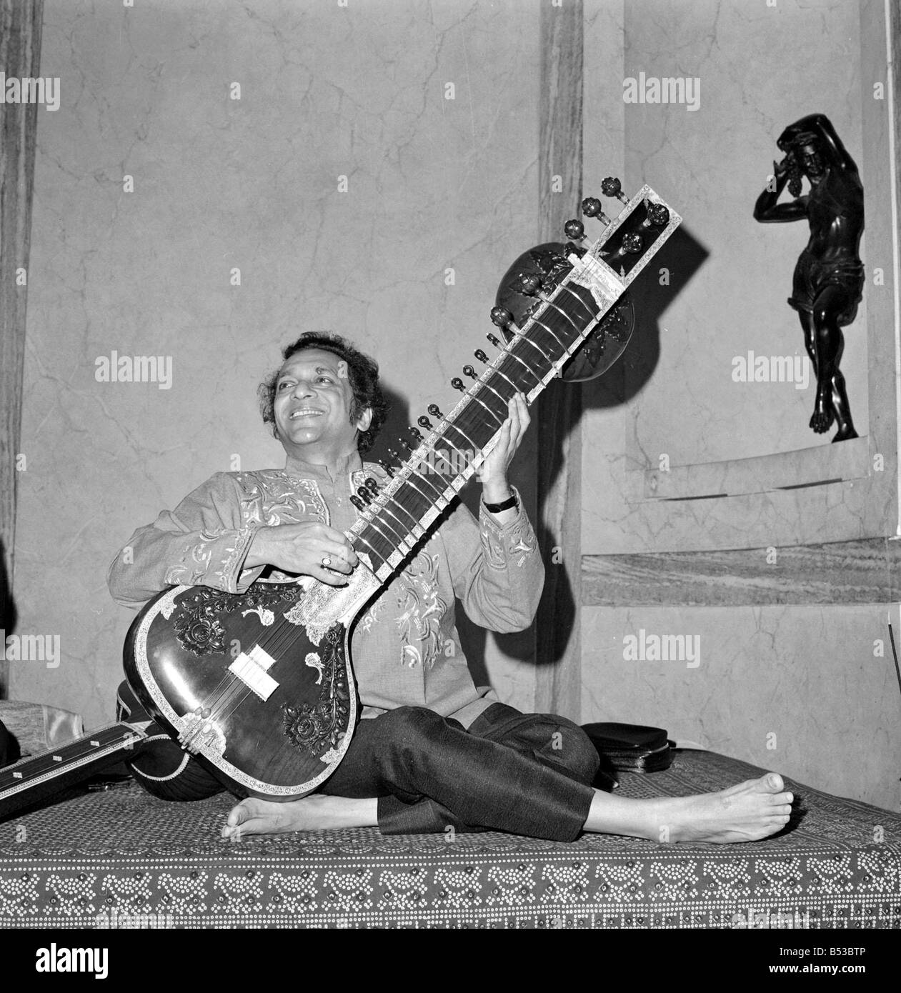 Ravi Shankar bare footed plays his sitar at the Hyde Park Hotel were he ...