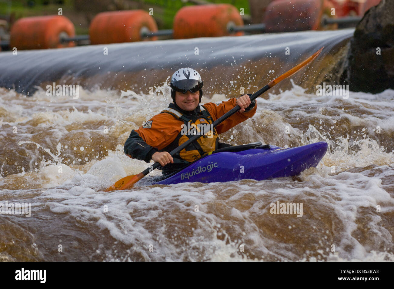 Caucasian male kayaker, in a blue kayak in white water Stock Photo - Alamy