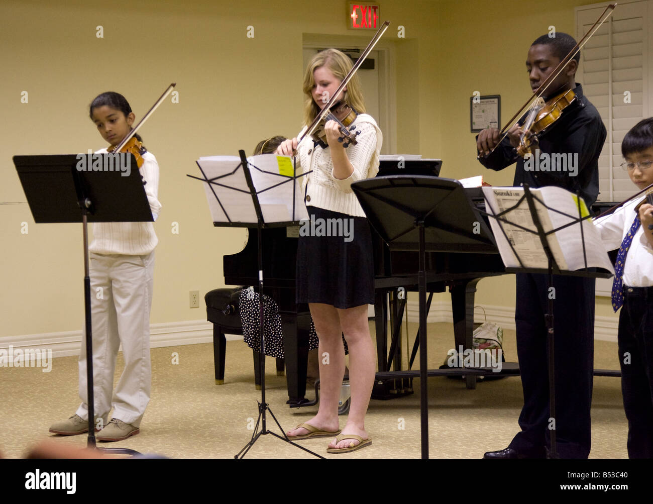 Four Young Violin Students Stock Photo - Alamy