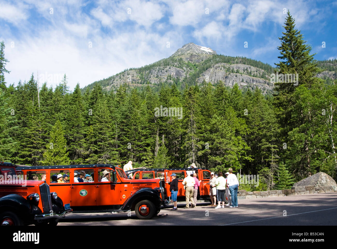 Propane powered red tour buses in Glacier National Park Montana Stock ...