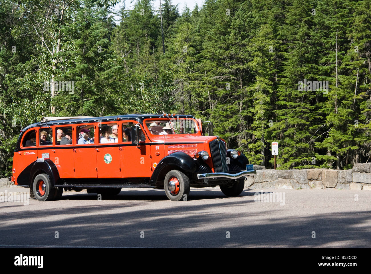 Propane powered red tour bus in Glacier National Park Montana Stock ...