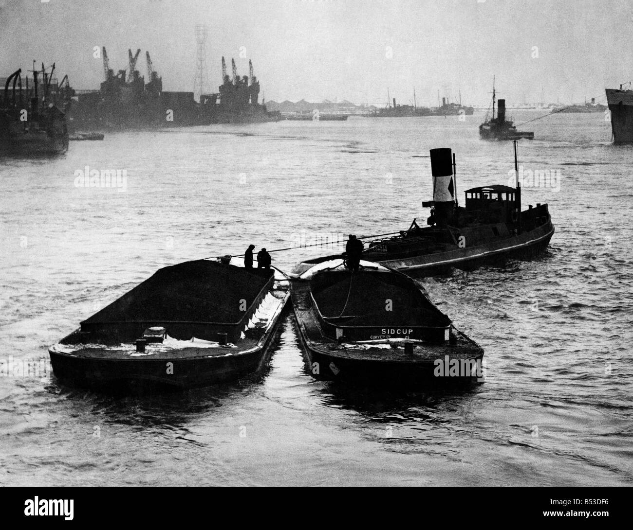 Coal arriving by boat iat a dockyard. February 1947 P017677 Stock Photo ...