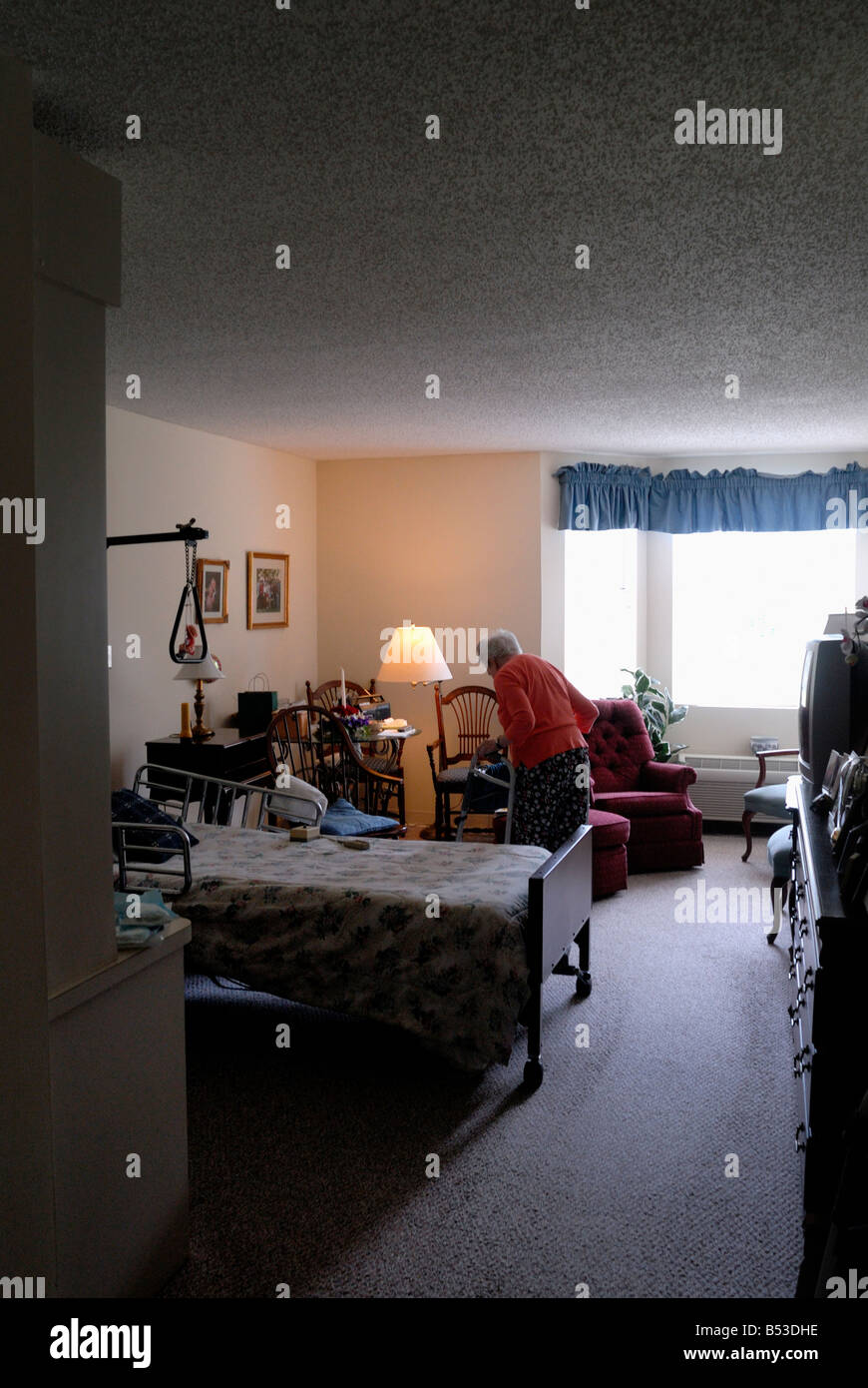 Old woman walker in apartment hi-res stock photography and images - Alamy